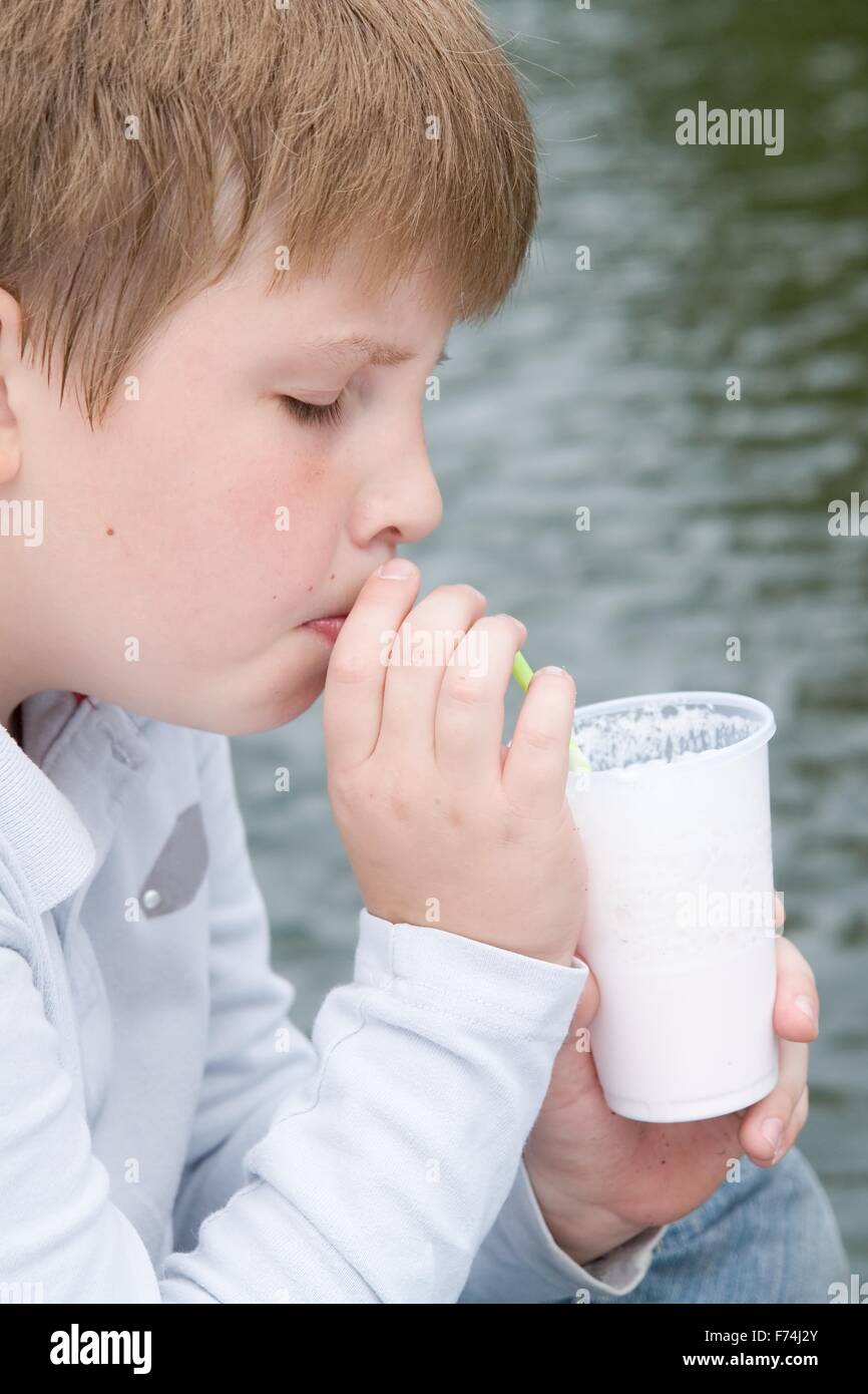 boy drinks milkshake Stock Photo - Alamy
