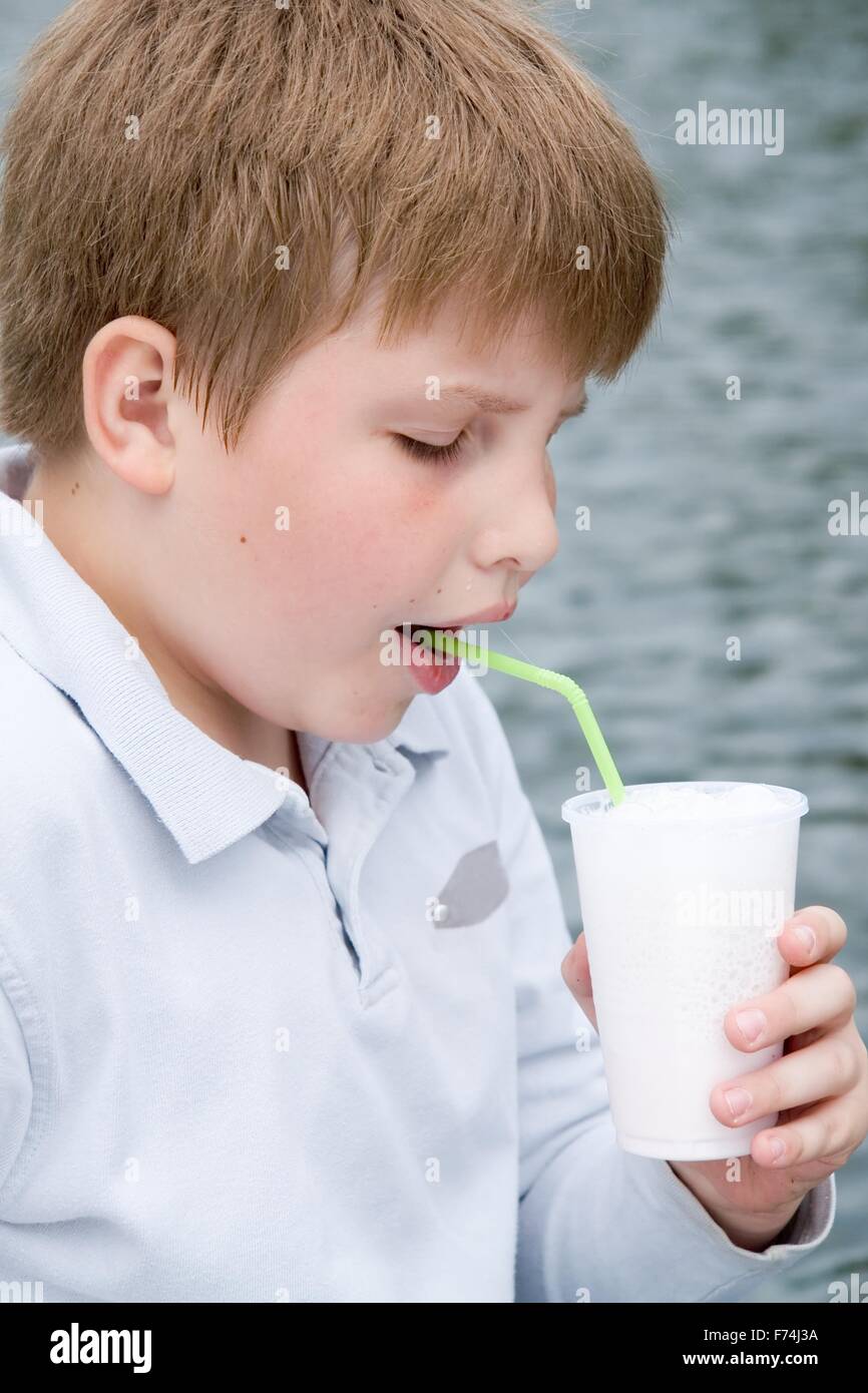 boy drinks milkshake Stock Photo - Alamy