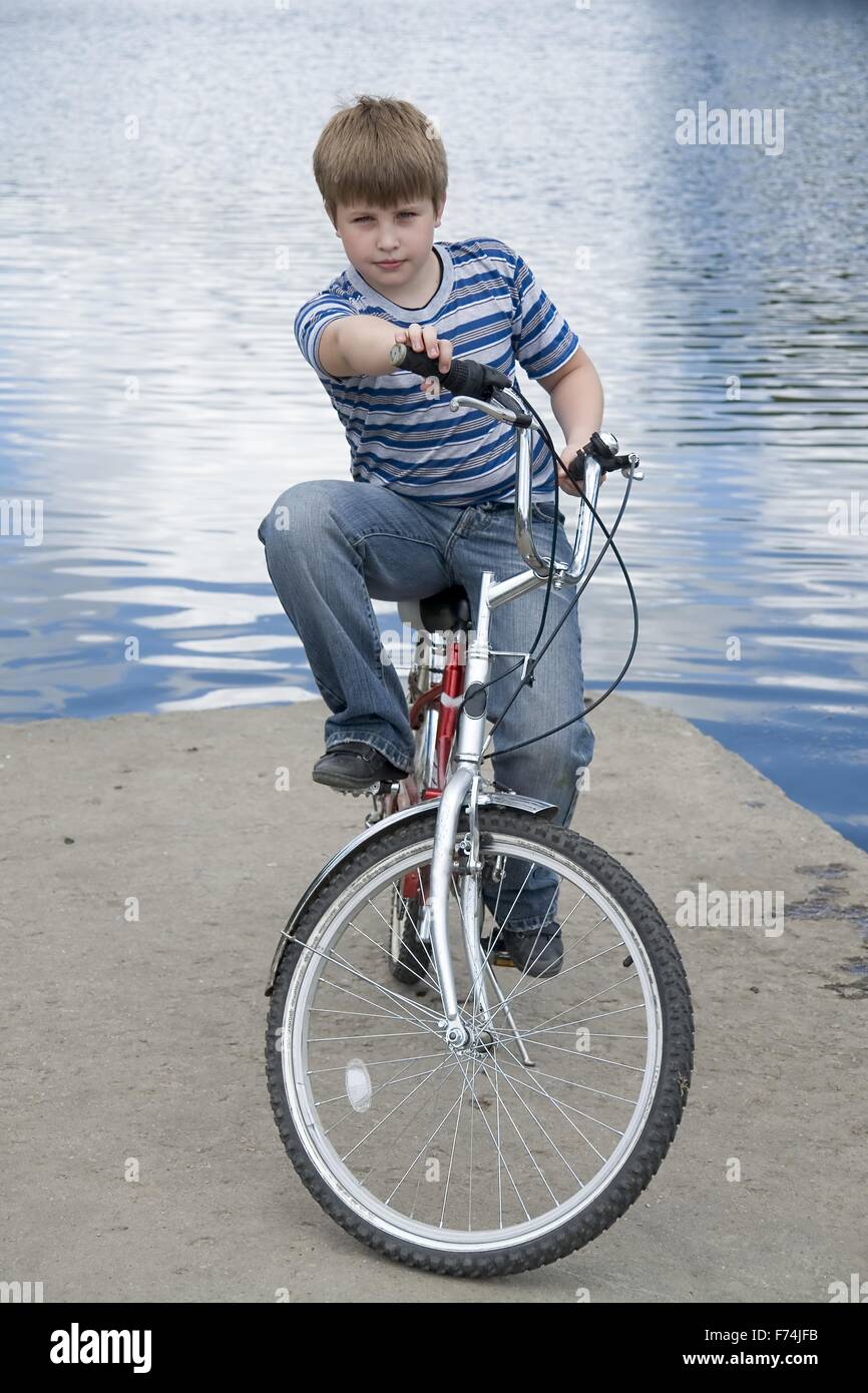 Boy on a bicycle Stock Photo - Alamy
