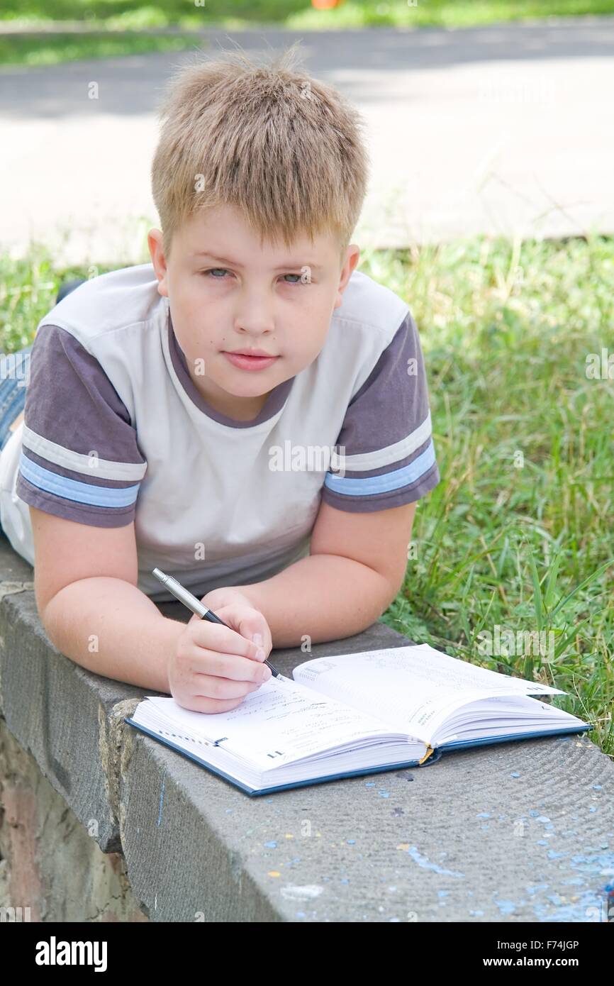little boy writes Stock Photo - Alamy