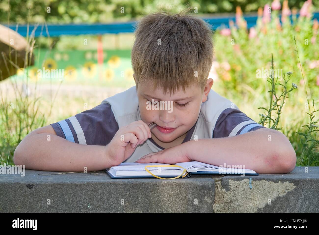 little boy writes Stock Photo - Alamy
