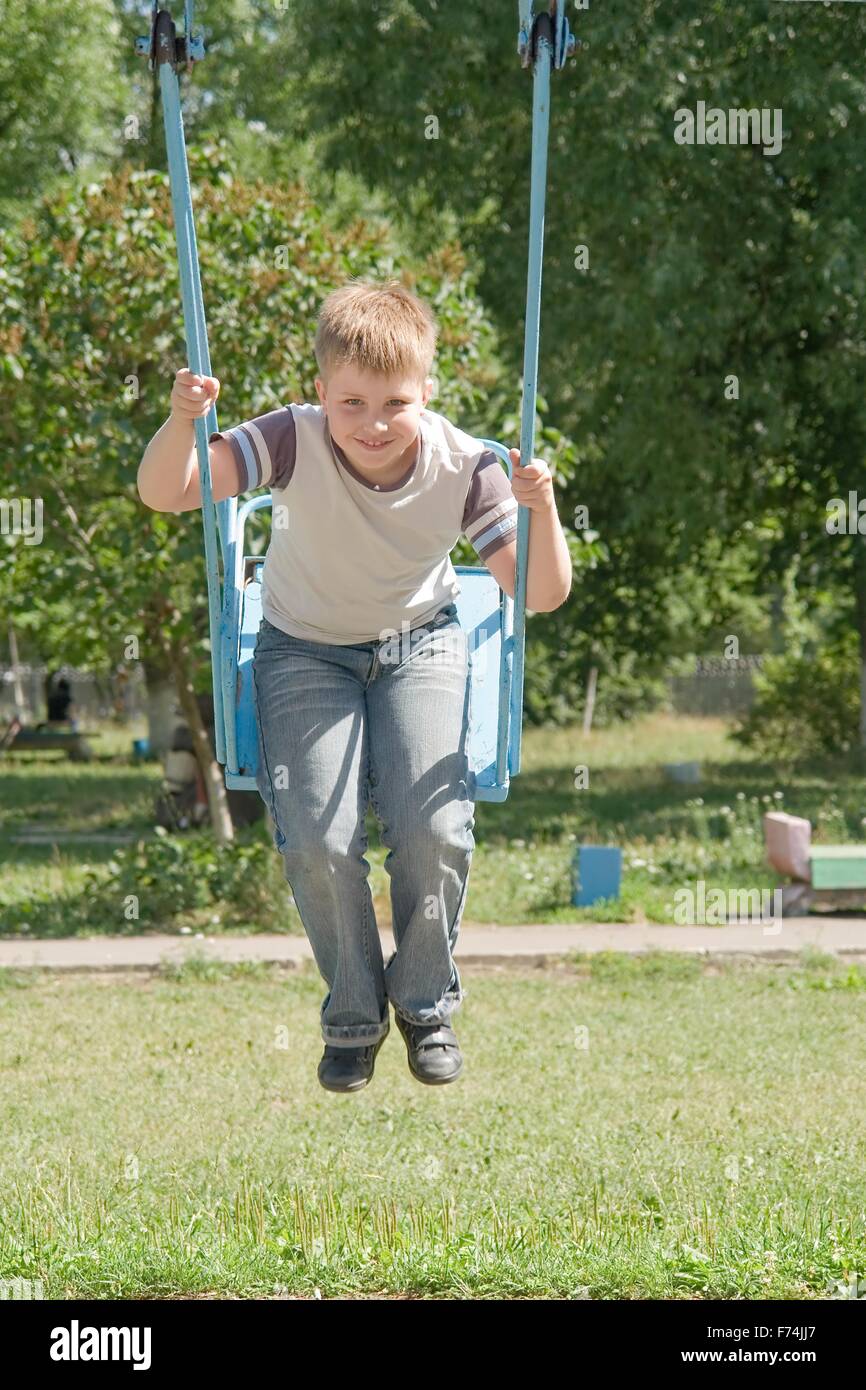 little boy on a swing Stock Photo - Alamy
