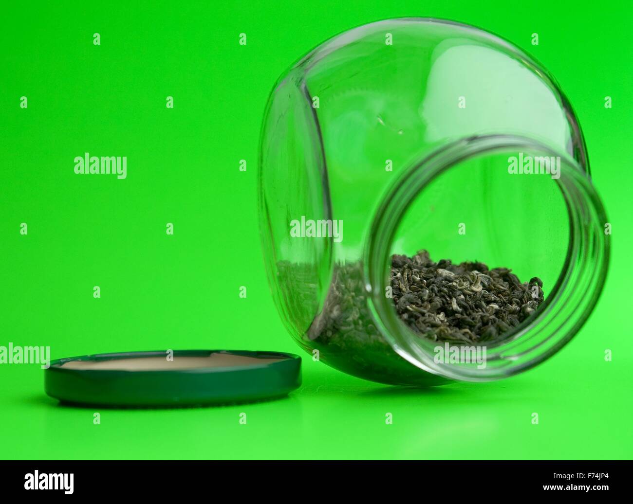 Green tea in glass jar Stock Photo - Alamy