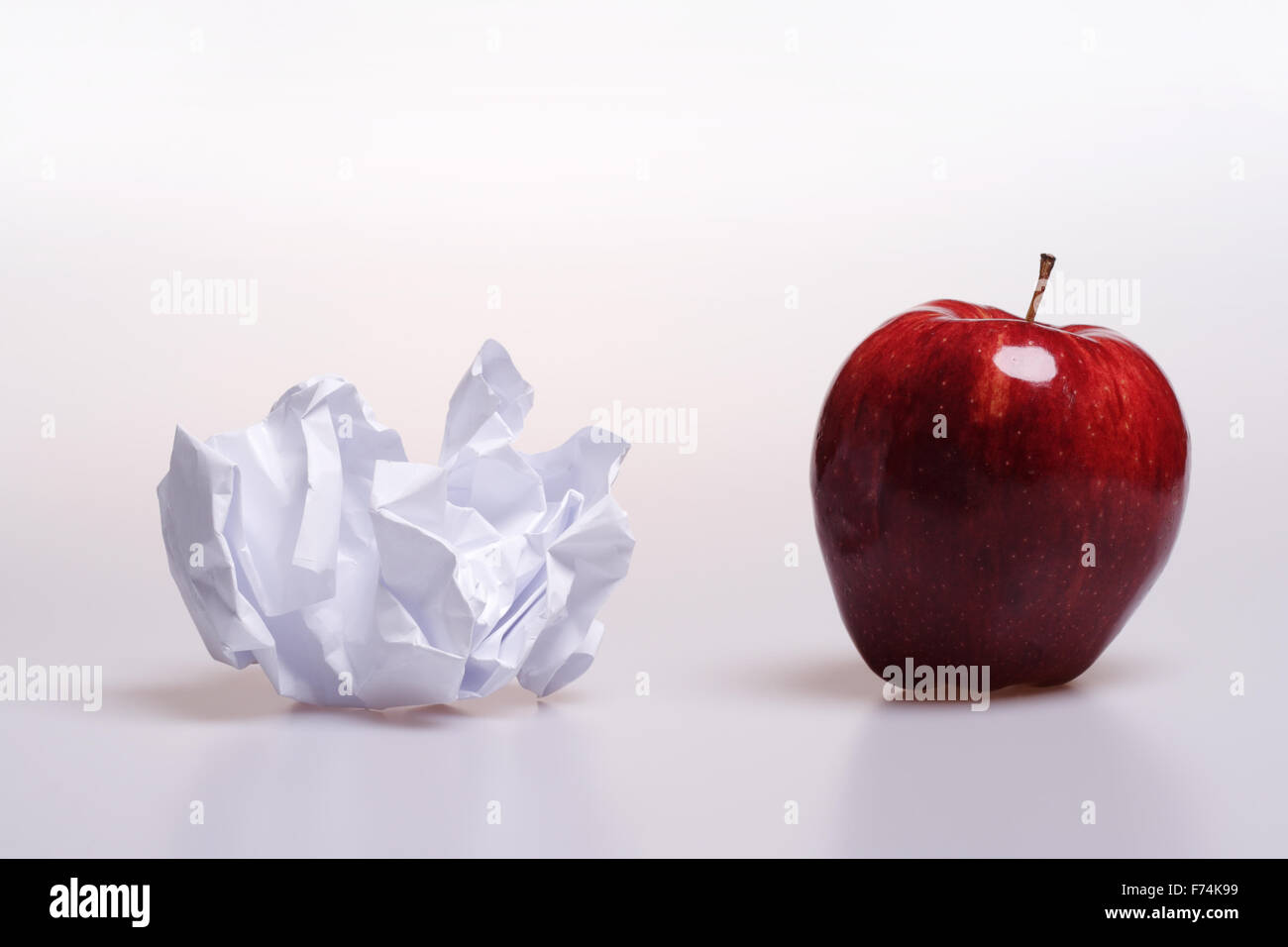 Apple and paper Stock Photo - Alamy