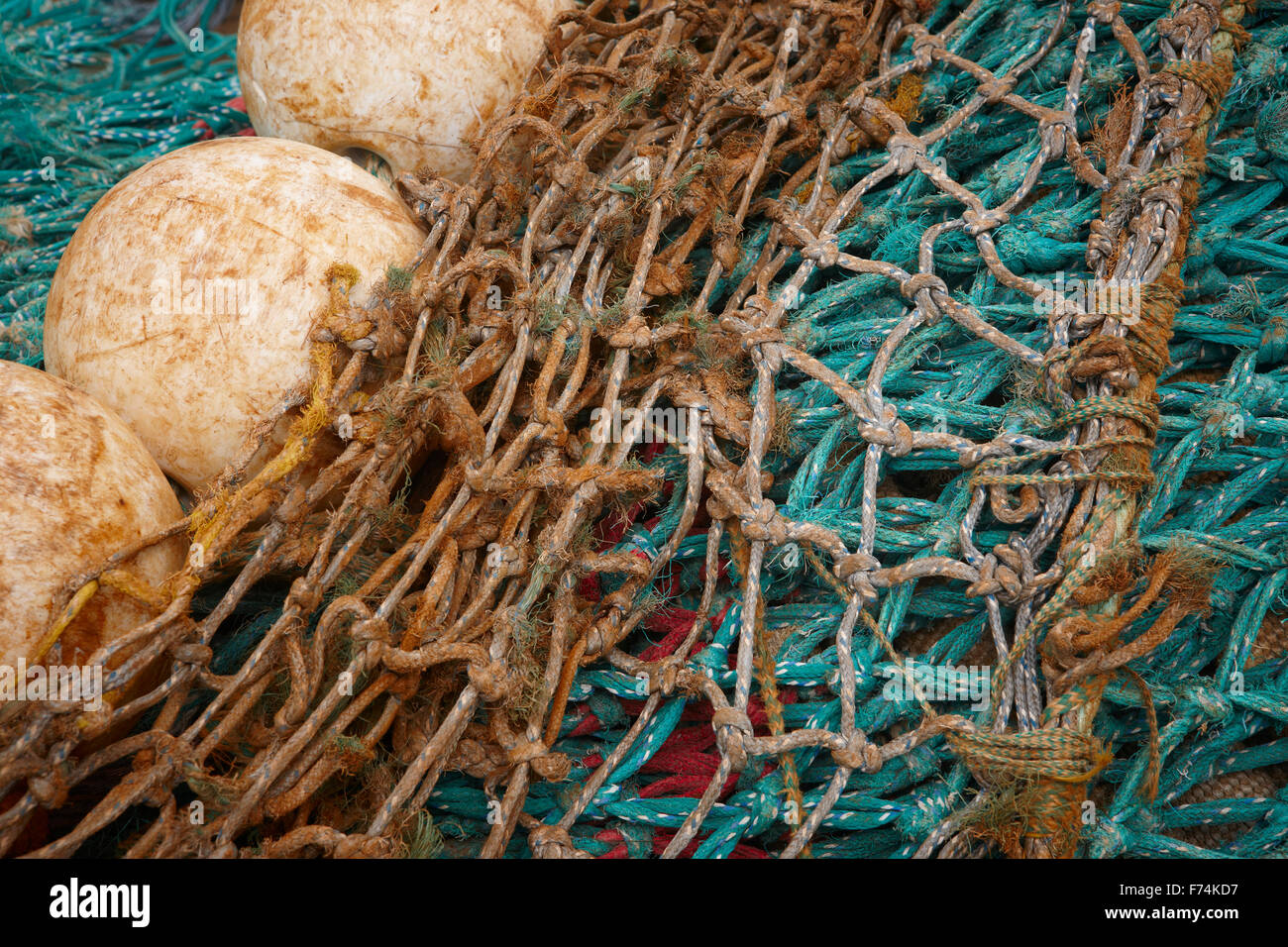 Fishing industry nets different colors with buoys close up Stock Photo ...