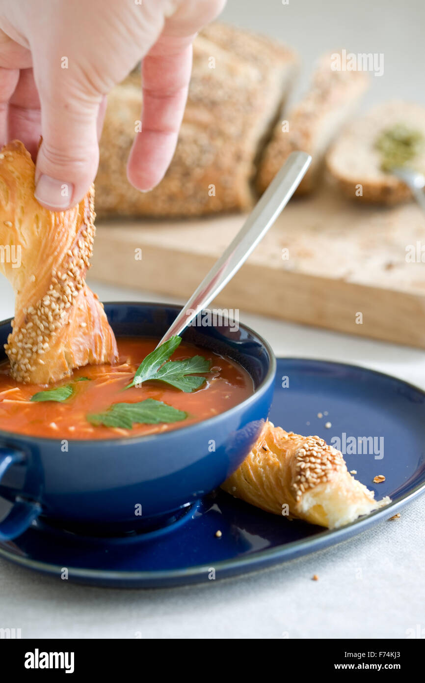 Dipping the bread Stock Photo - Alamy