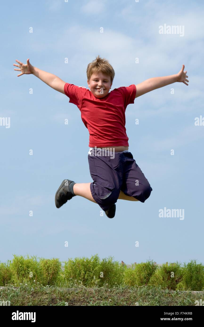 One boy jumping hi-res stock photography and images - Alamy
