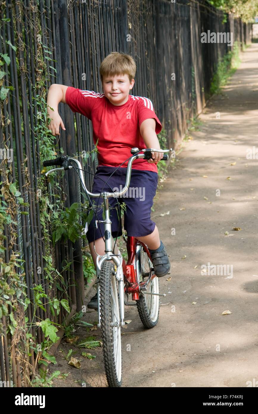 Boy on a bicycle Stock Photo - Alamy