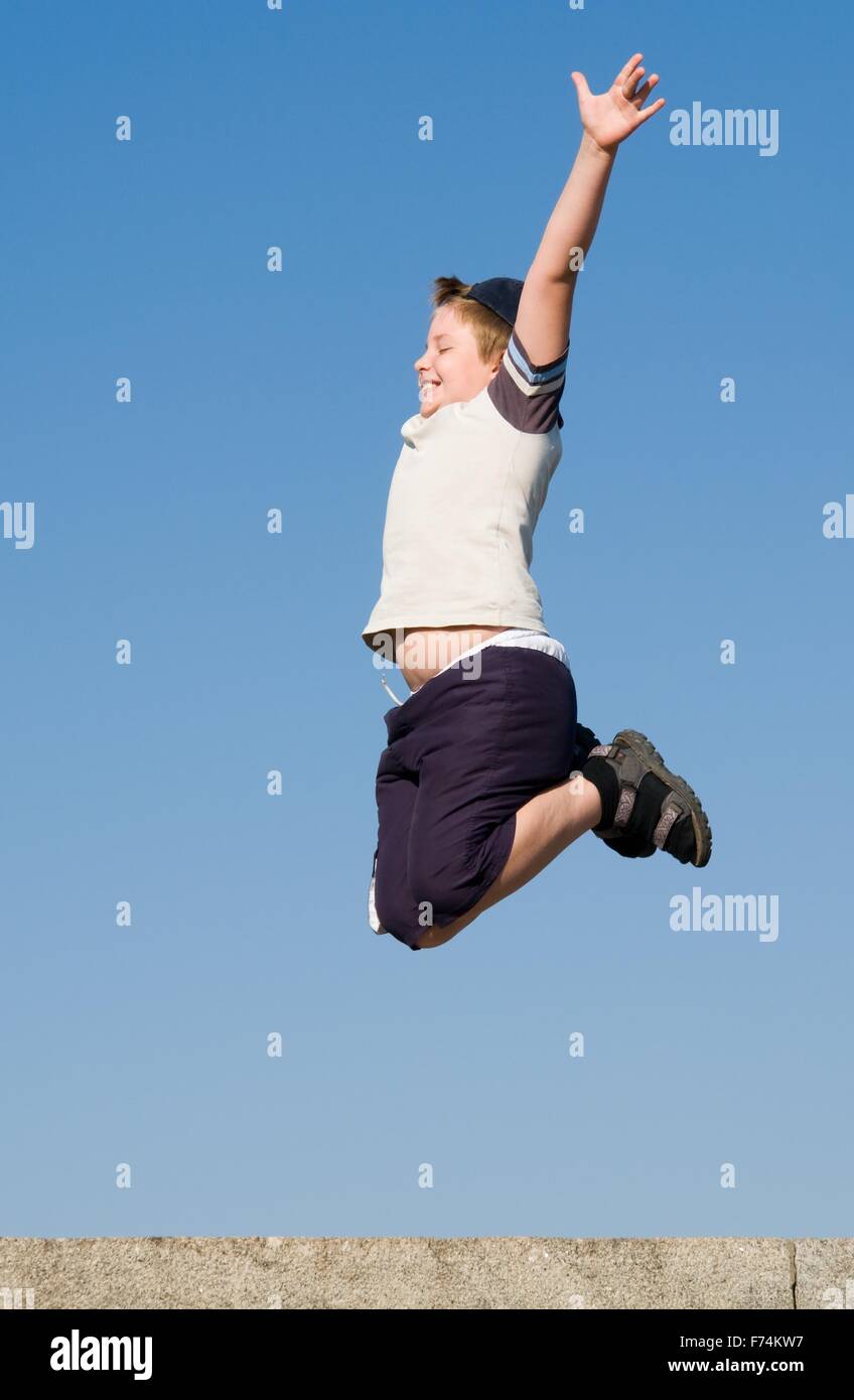 One boy jumping hi-res stock photography and images - Alamy