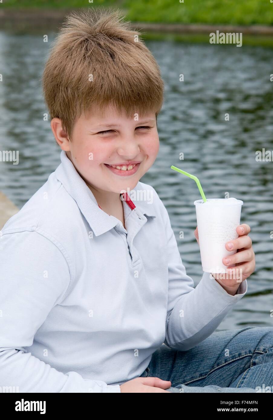 boy drinks milkshake Stock Photo - Alamy