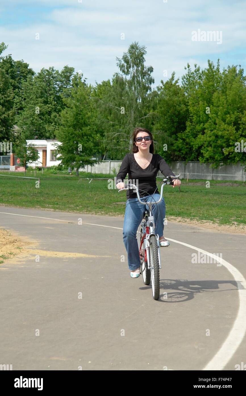 woman on a bicycle Stock Photo - Alamy