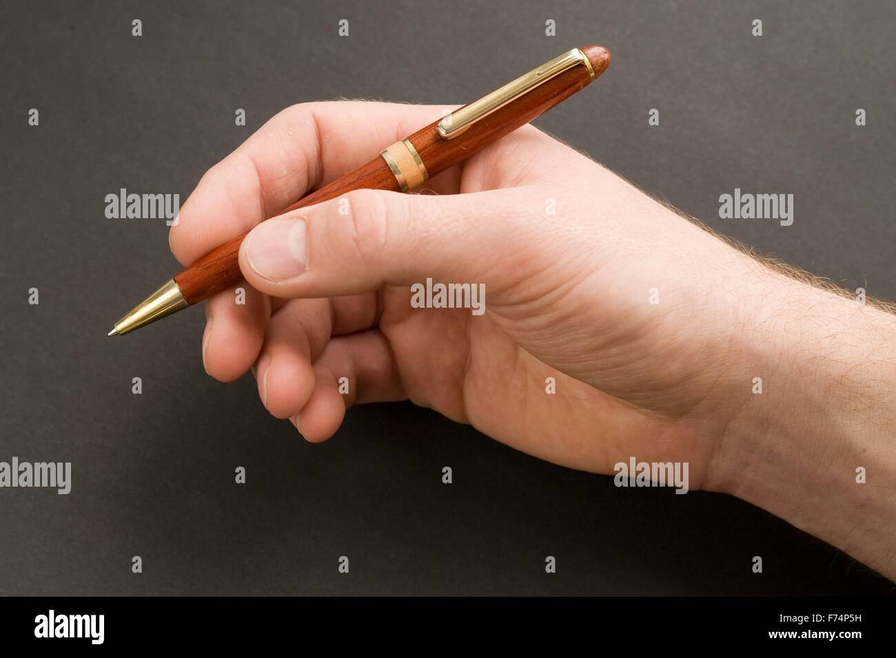 Hand with a pen Stock Photo - Alamy