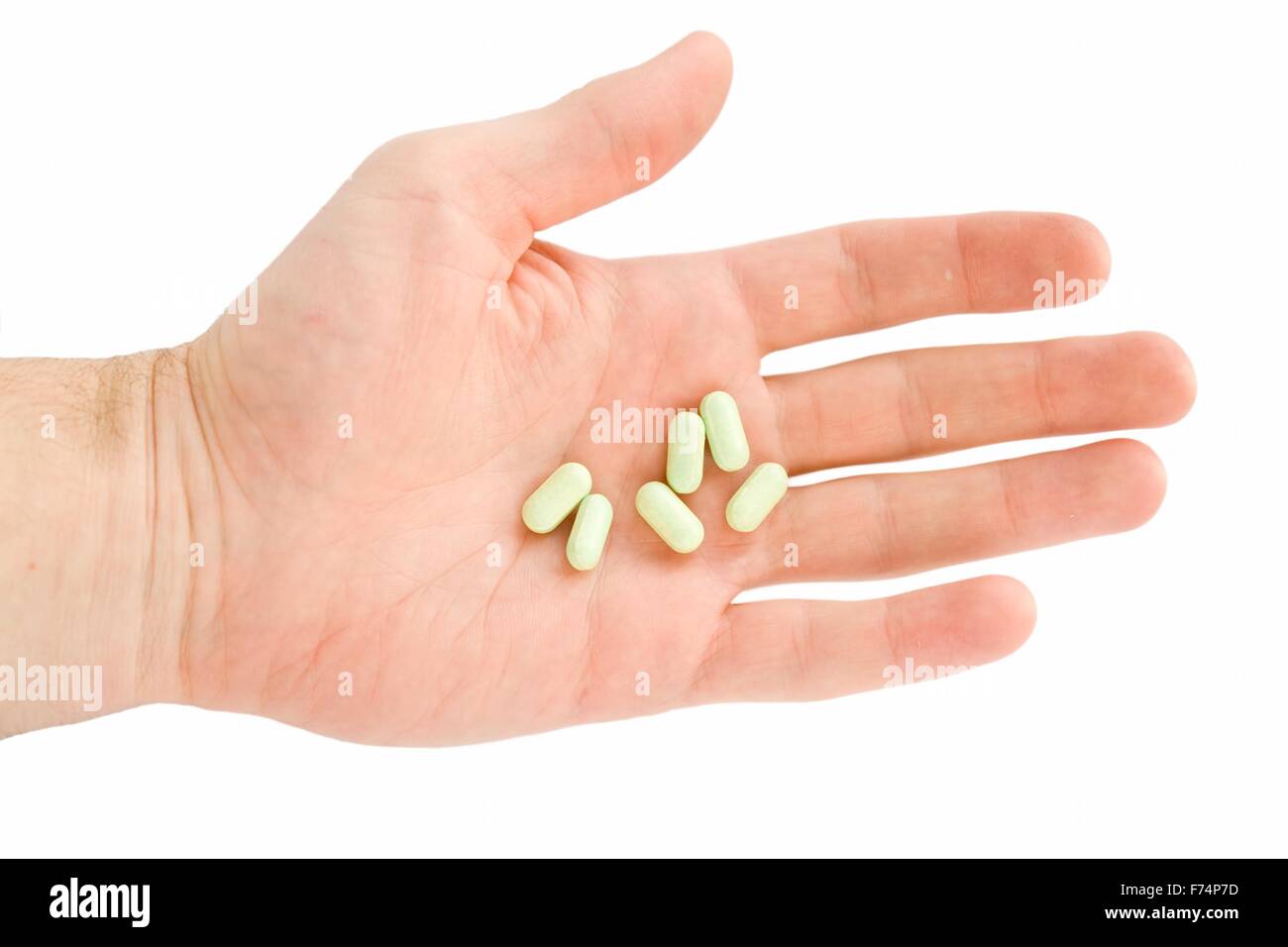 hand with pills Stock Photo - Alamy