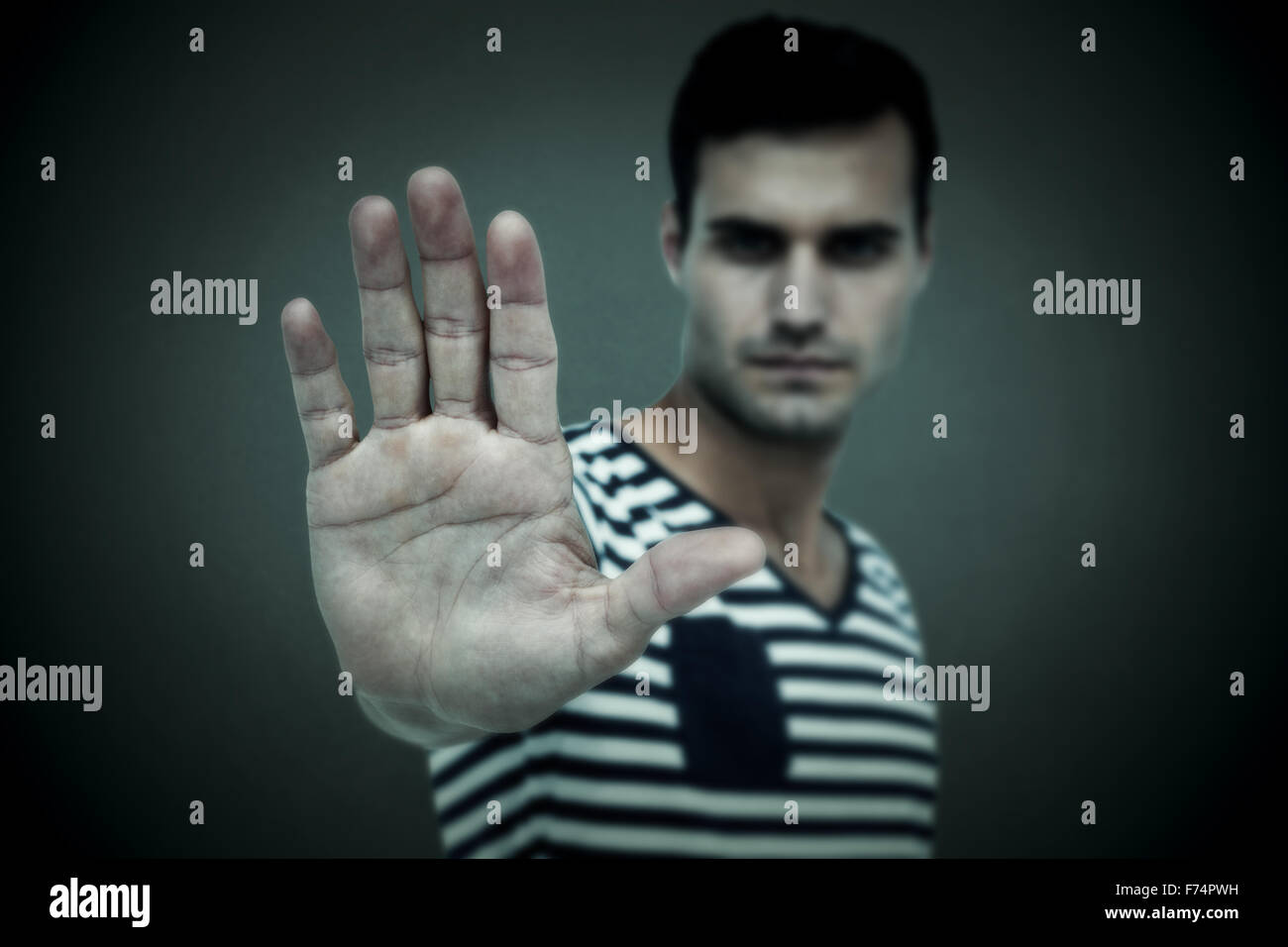 Composite image of portrait of serious man making stop sign Stock Photo ...