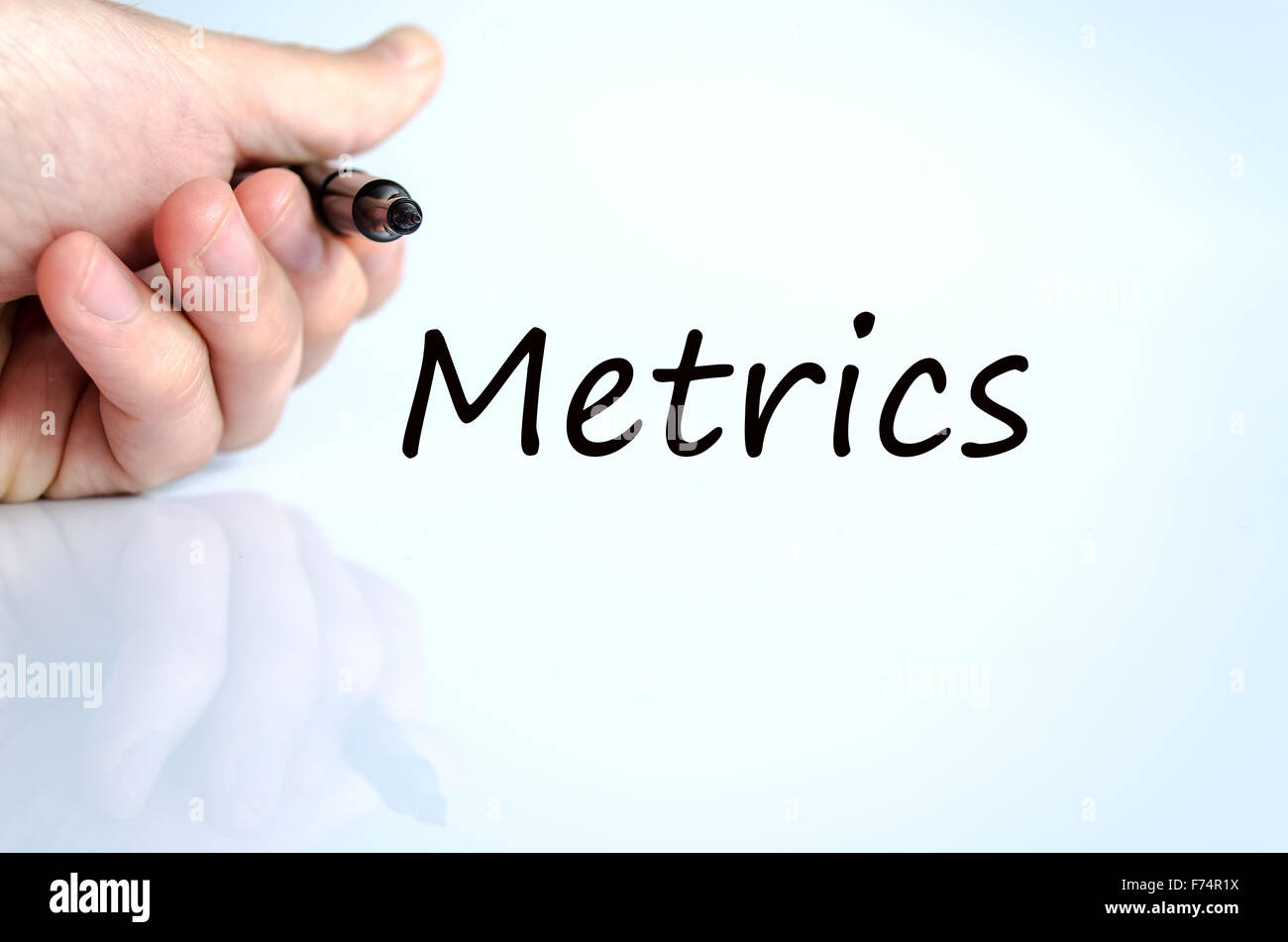 Metrics text concept isolated over white background Stock Photo - Alamy
