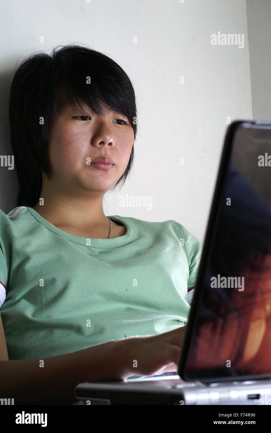 Young asian lady using laptop Stock Photo - Alamy