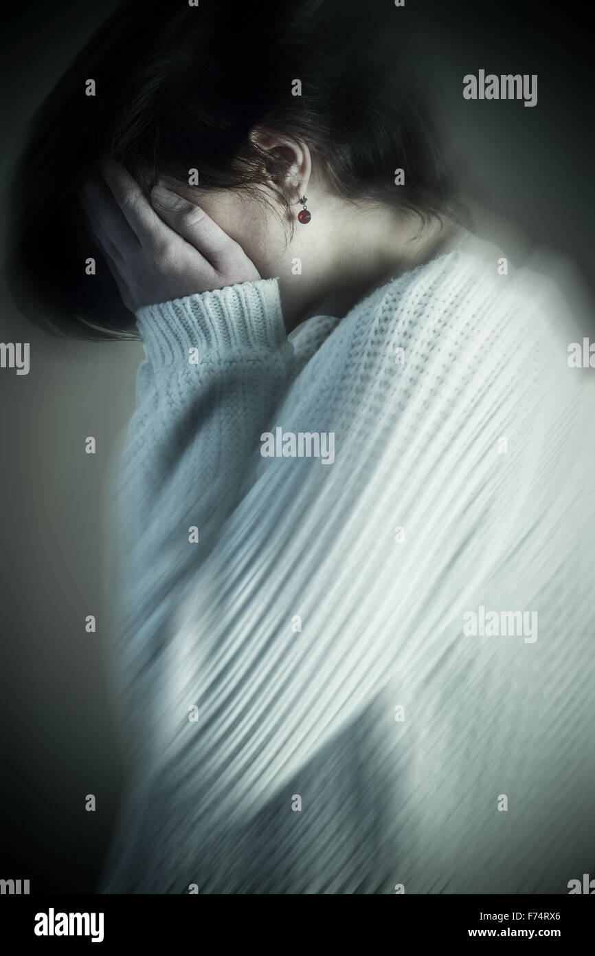 Composite image of sad pretty brunette crying with head on hands Stock ...