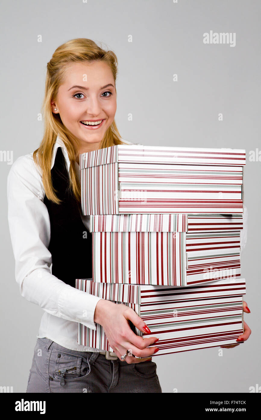 Woman picking up boxes hi-res stock photography and images - Alamy