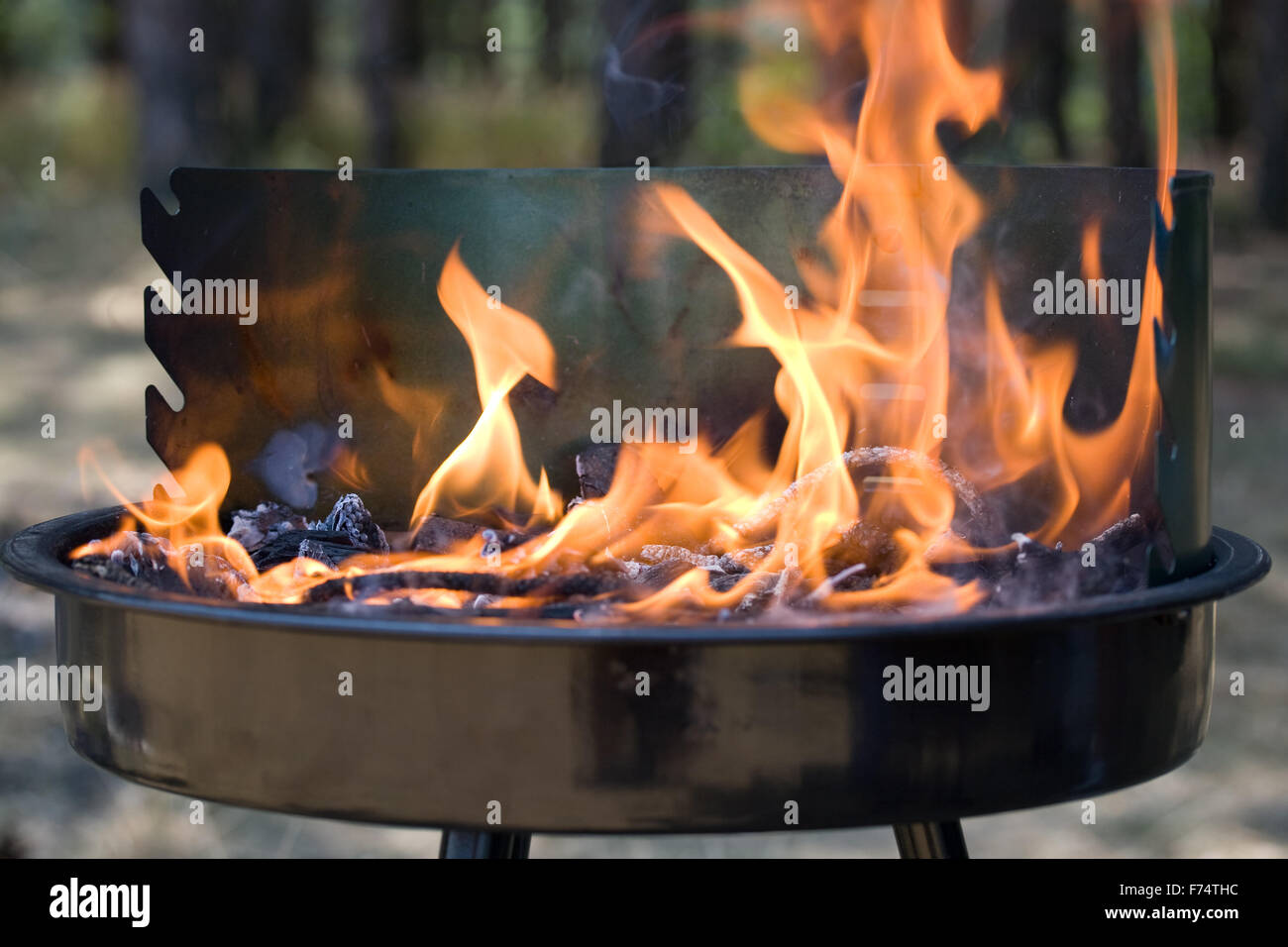 Barbeque in flames Stock Photo - Alamy
