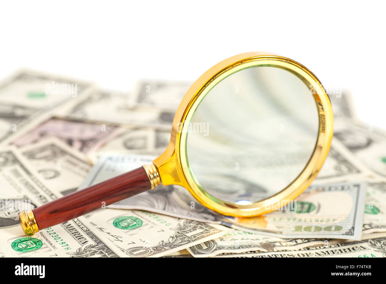 dollar banknotes under magnifying glass isolated Stock Photo - Alamy
