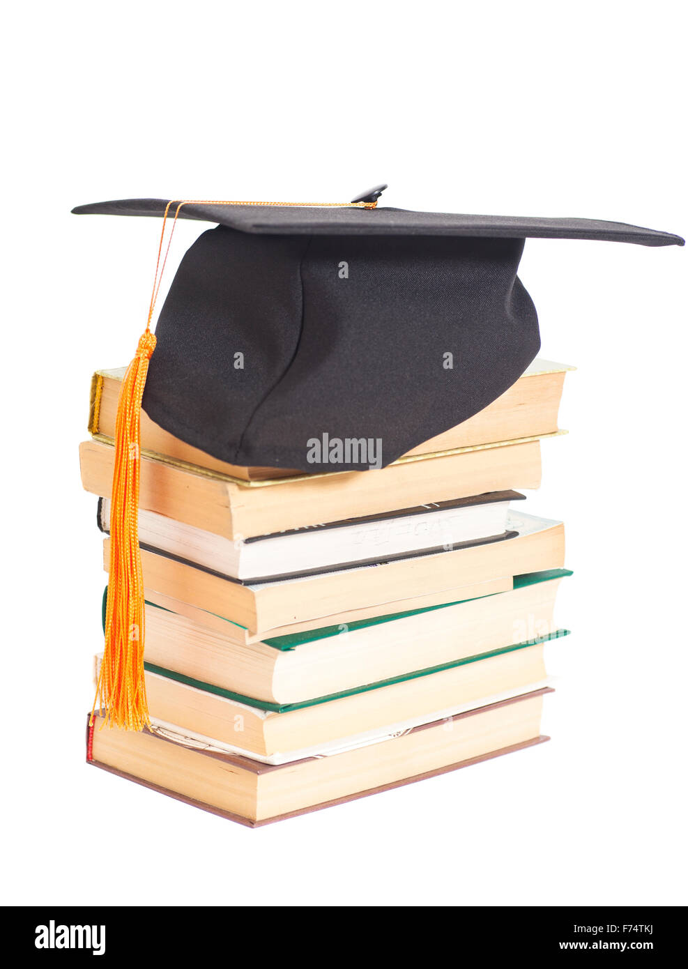 Graduation cap on stack books Cut Out Stock Images & Pictures - Alamy