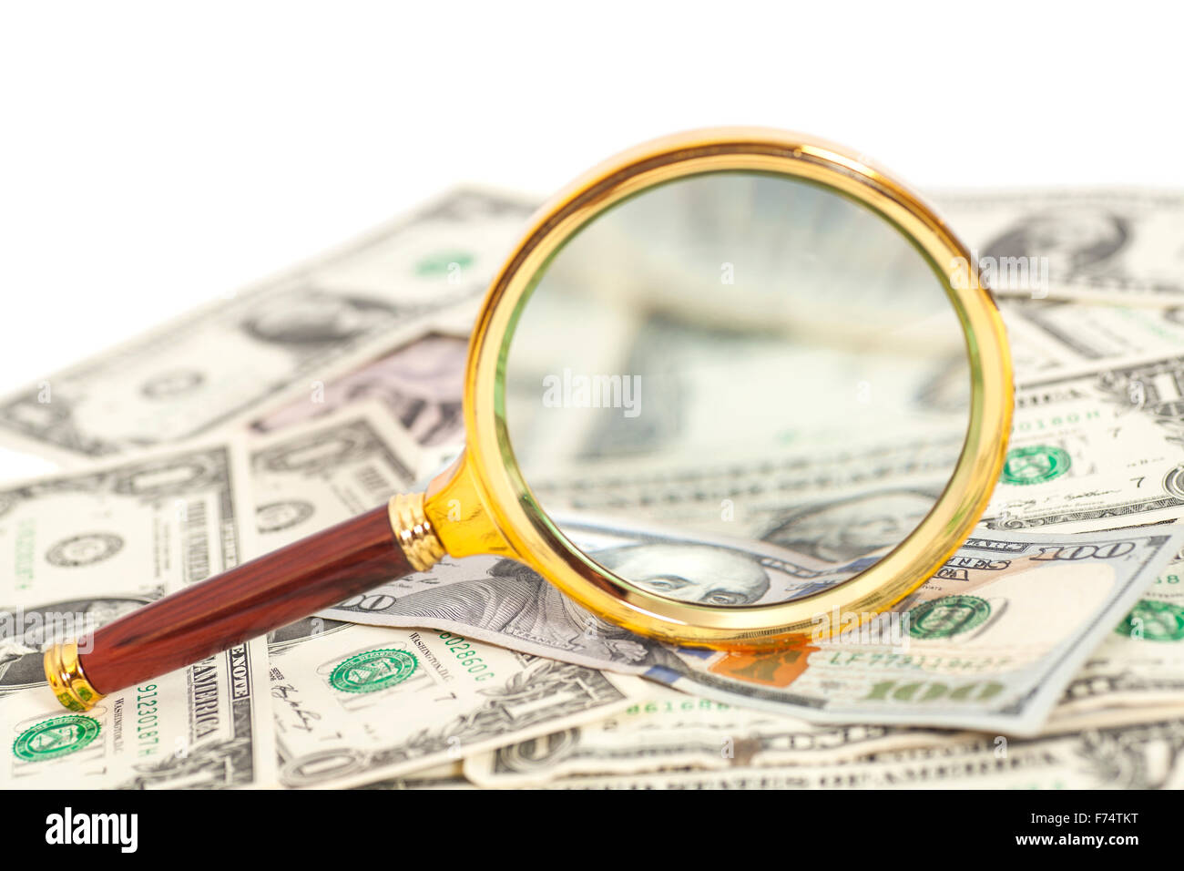 dollar banknotes under magnifying glass isolated Stock Photo - Alamy