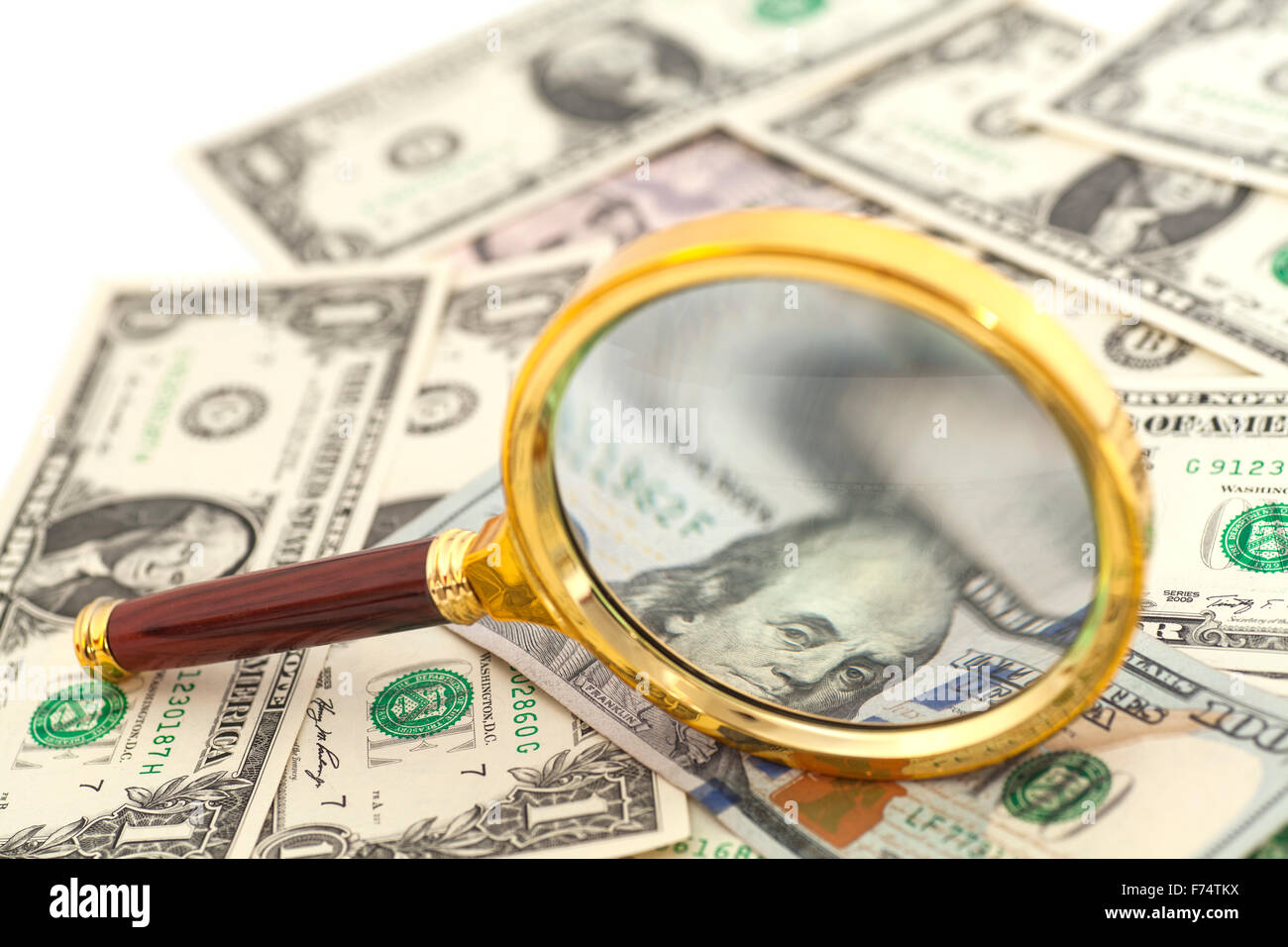 dollar banknotes under magnifying glass isolated Stock Photo - Alamy