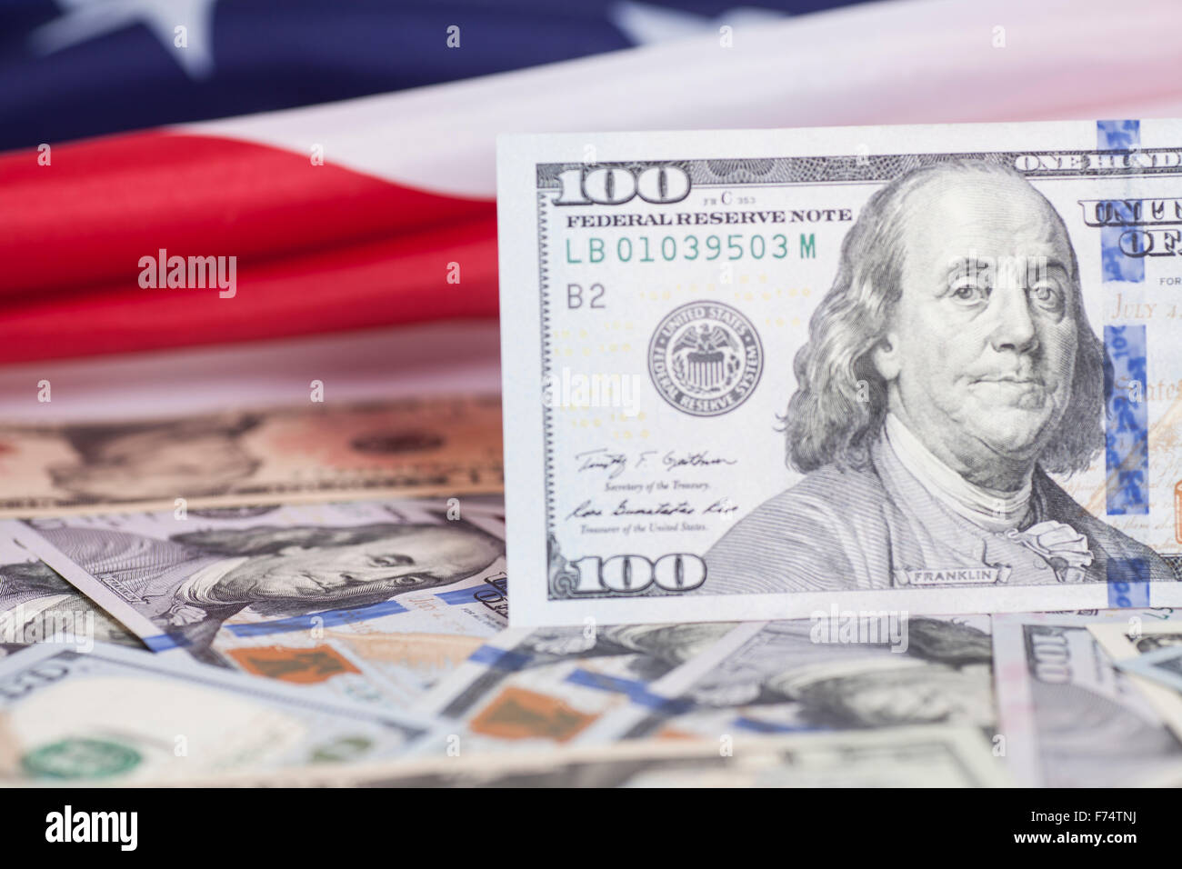 Dollar banknotes on American Flag Stock Photo - Alamy