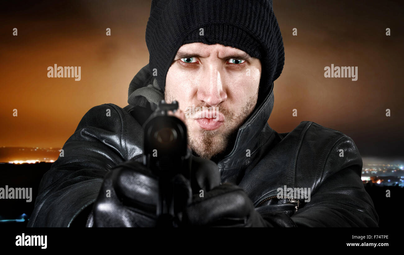 Undercover agent firing gun in the camera Stock Photo - Alamy