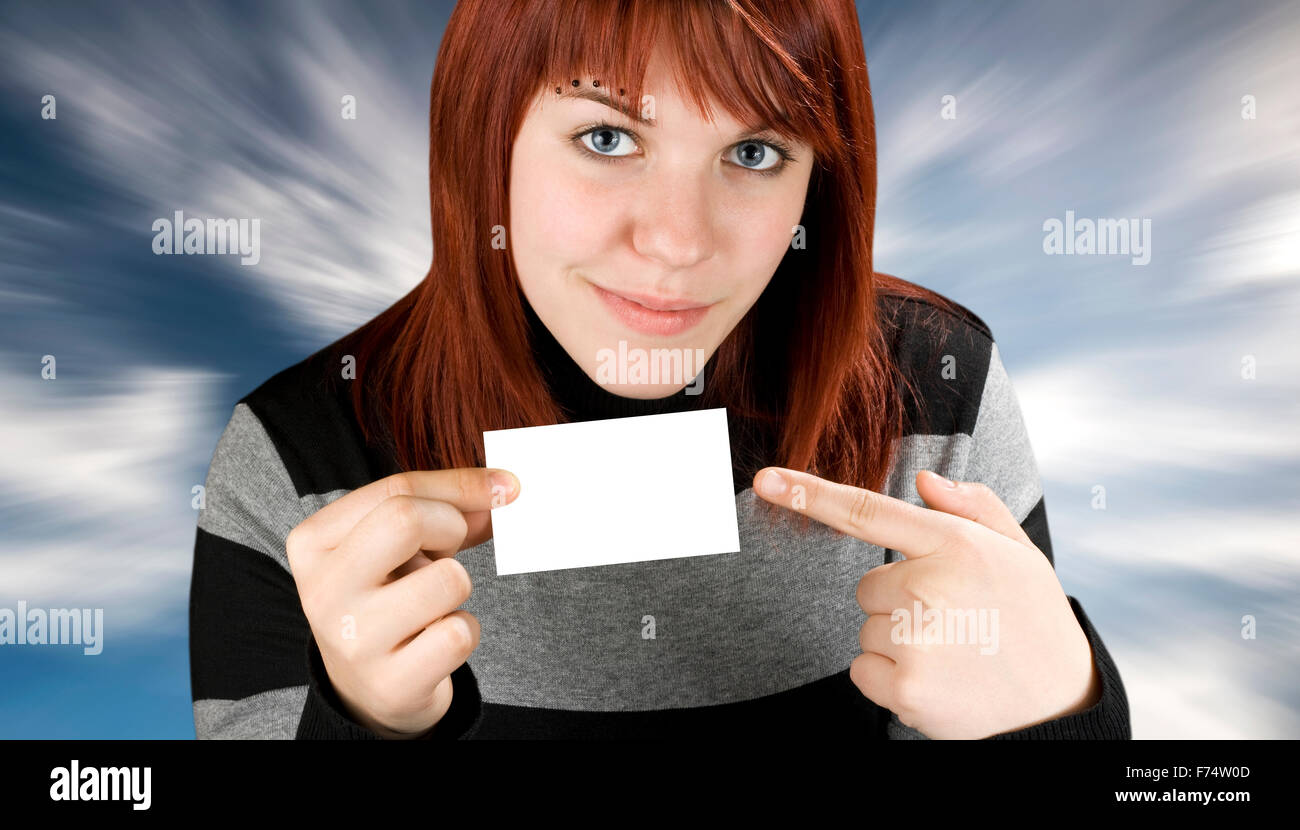 Girl pointing at a blank business card Stock Photo - Alamy