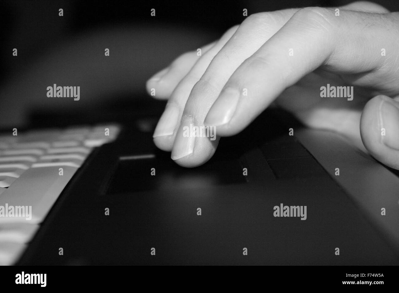 Fingers touching a notebook touchpad Stock Photo - Alamy