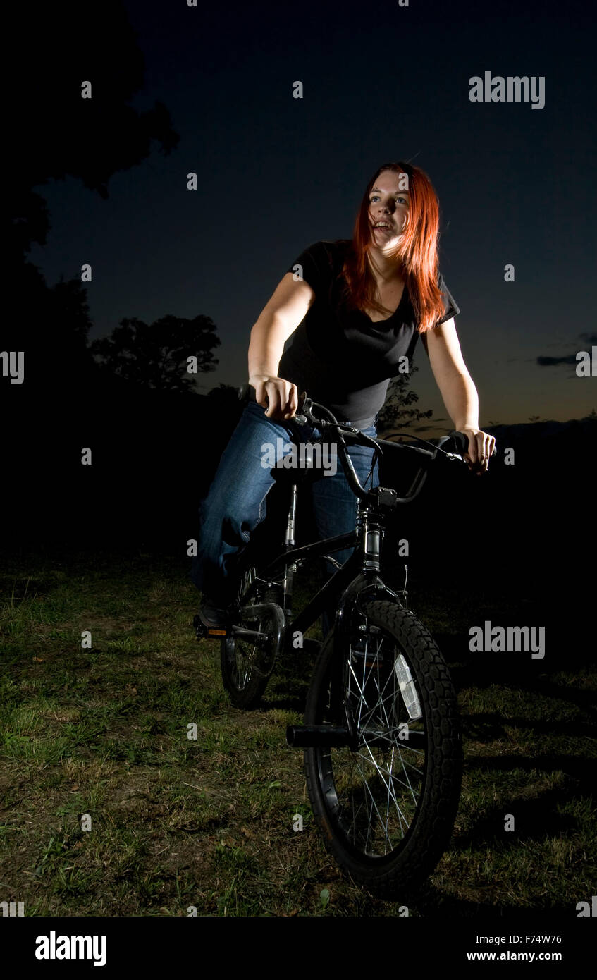 Girl riding a bmx bike Stock Photo - Alamy