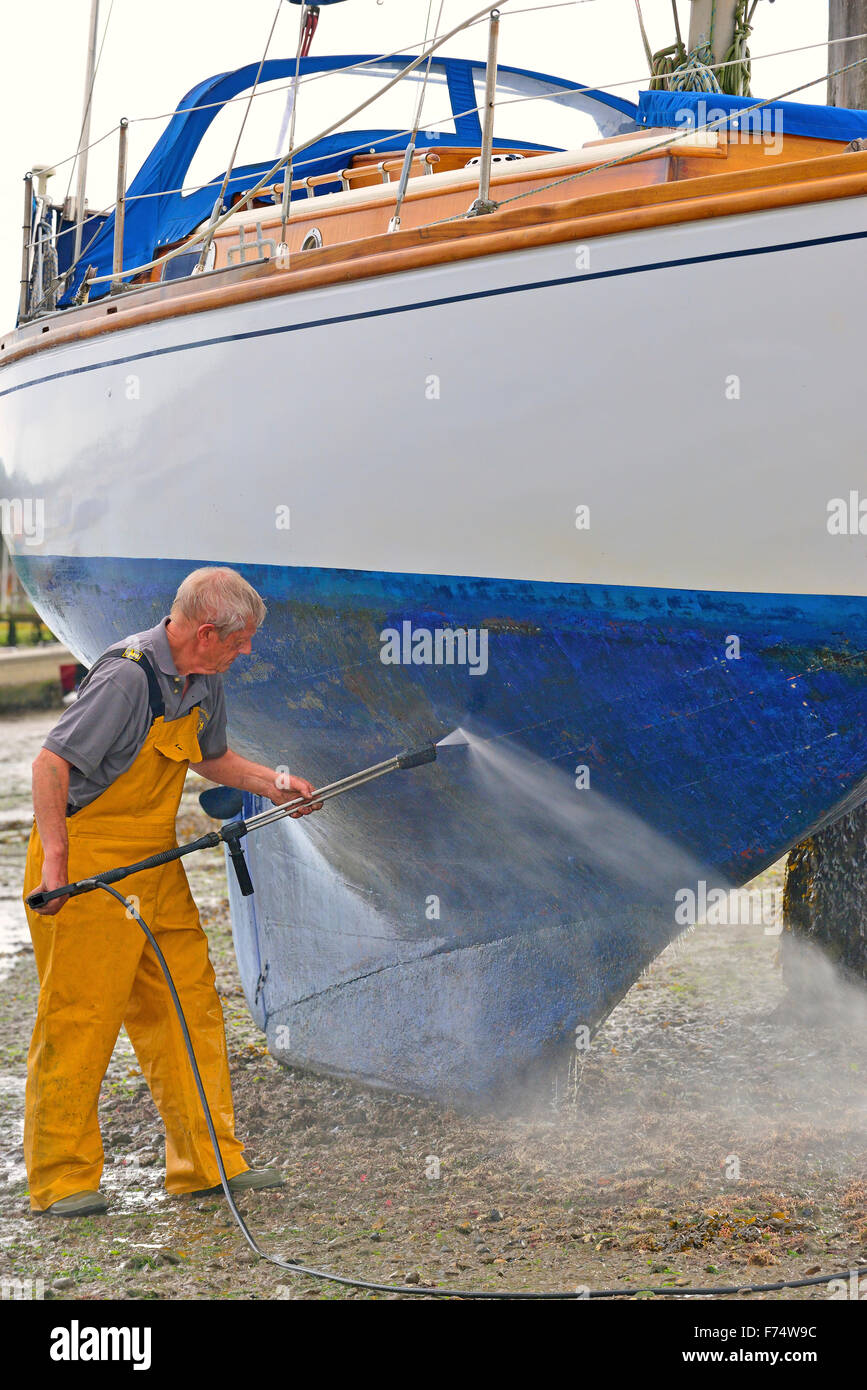 Sterling' class yacht being scrubbed off at low tide before the winter ...