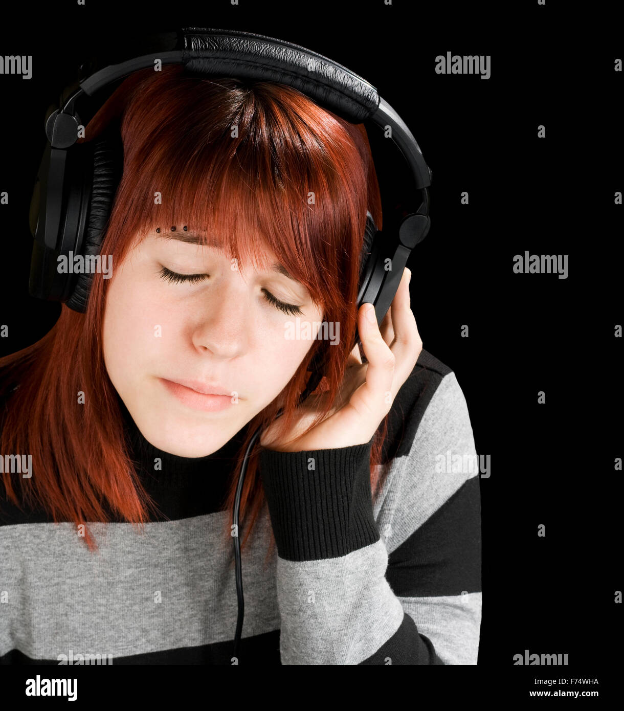 Pensive girl listening to music Stock Photo - Alamy