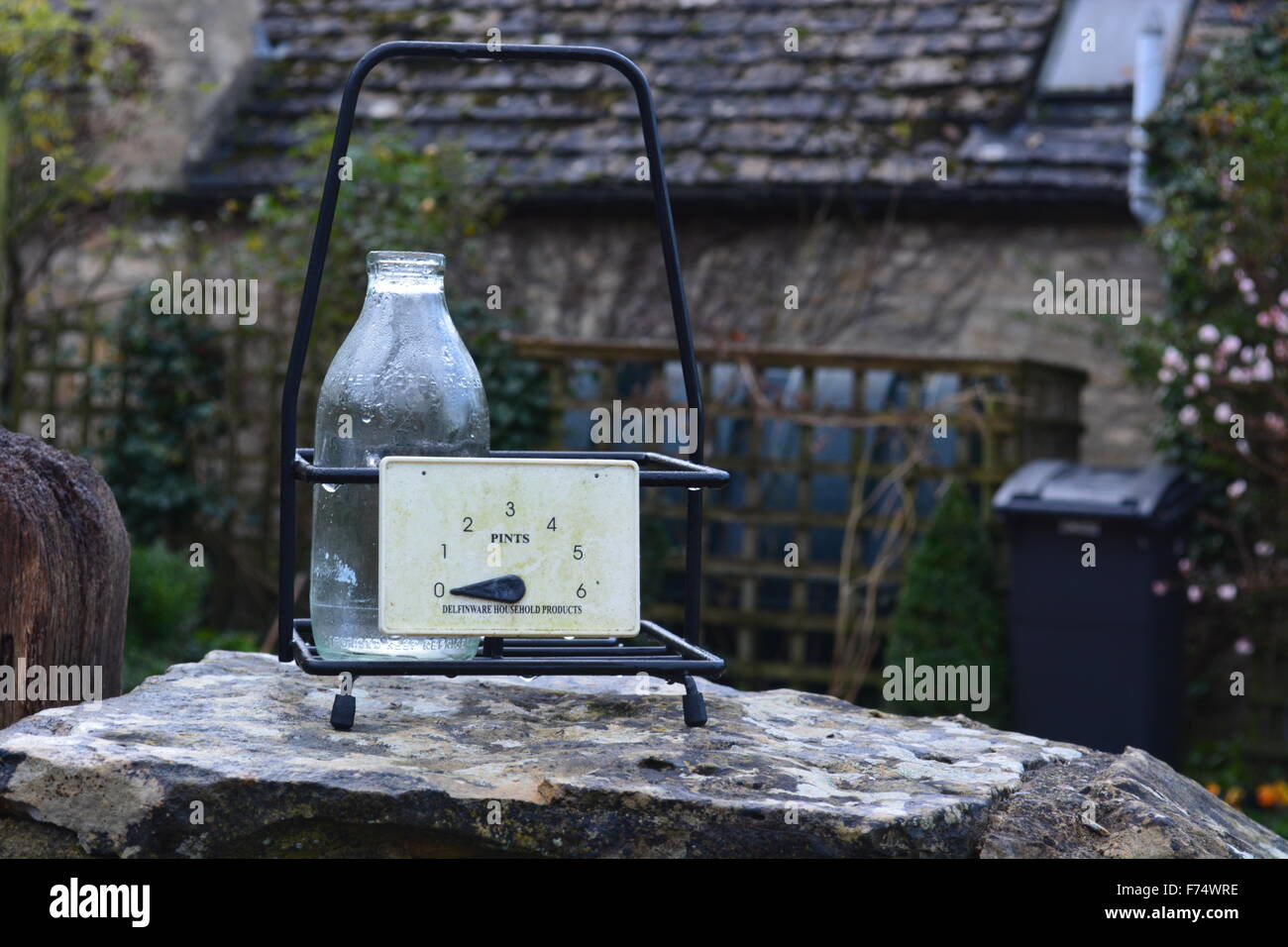 An empty milk bottle awaits the milkman on a cold winter's morning ...