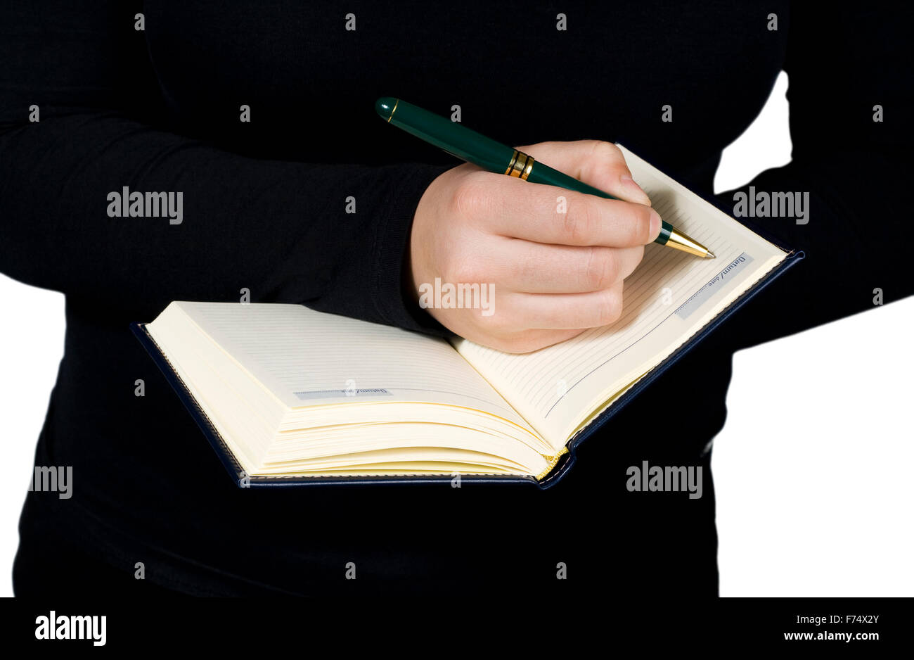 Female hand writing in a notebook Stock Photo - Alamy