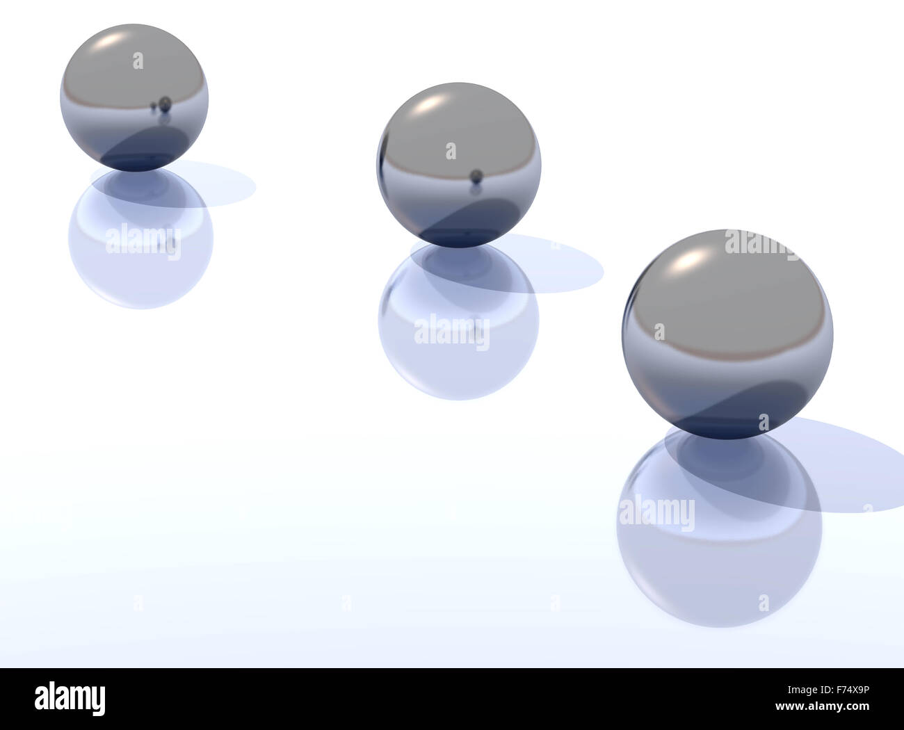 Three metal spheres Stock Photo - Alamy