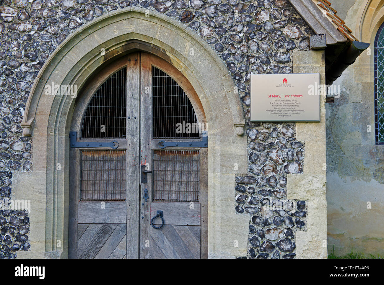 Plaque on porch of St Mary's Church, Luddenham, saying it's in the care ...
