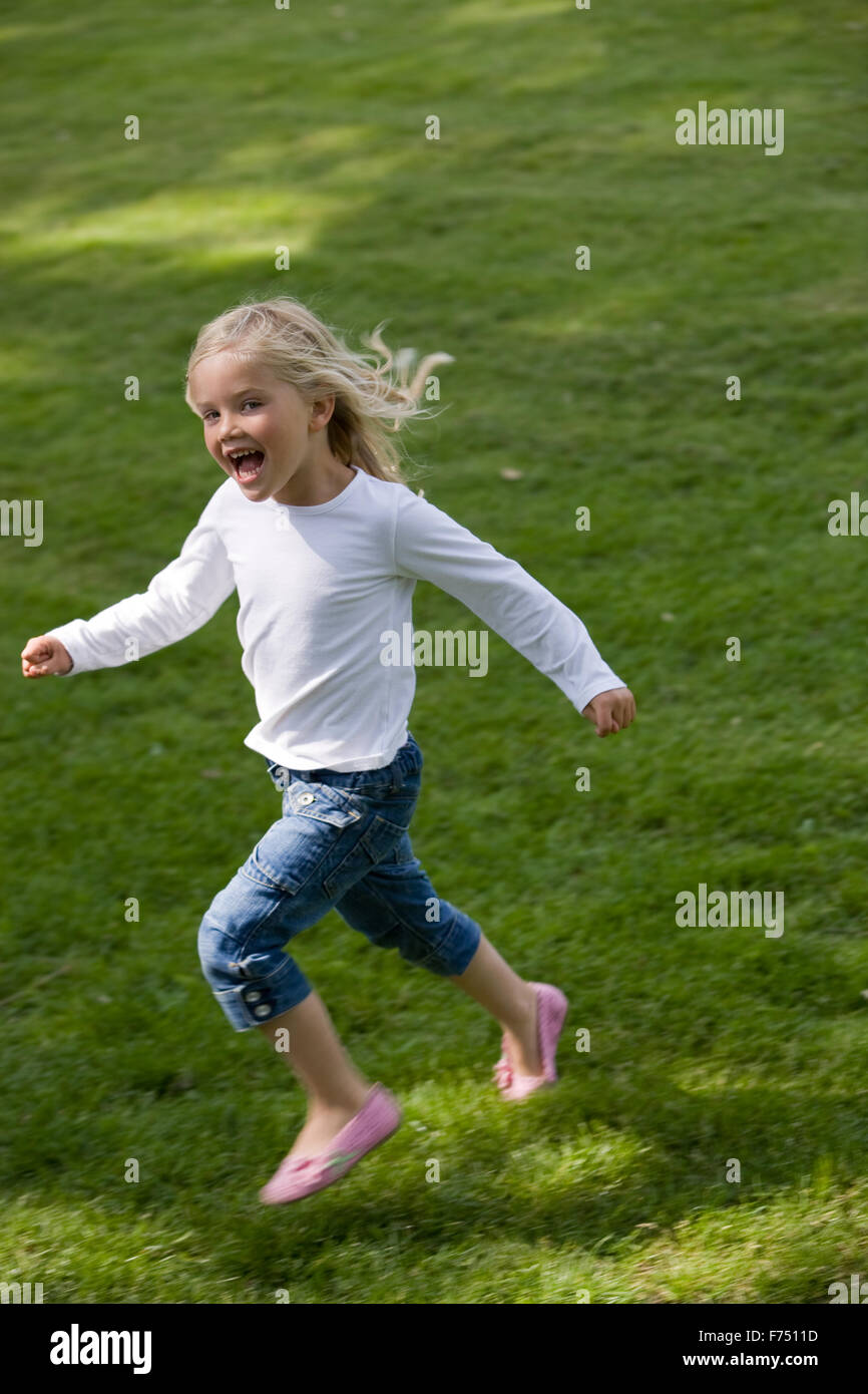 Preschool girl running on hi-res stock photography and images - Alamy