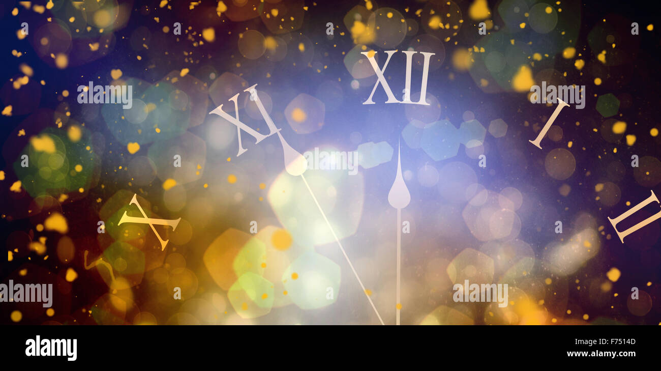 Composite image of clock counting down to midnight Stock Photo - Alamy