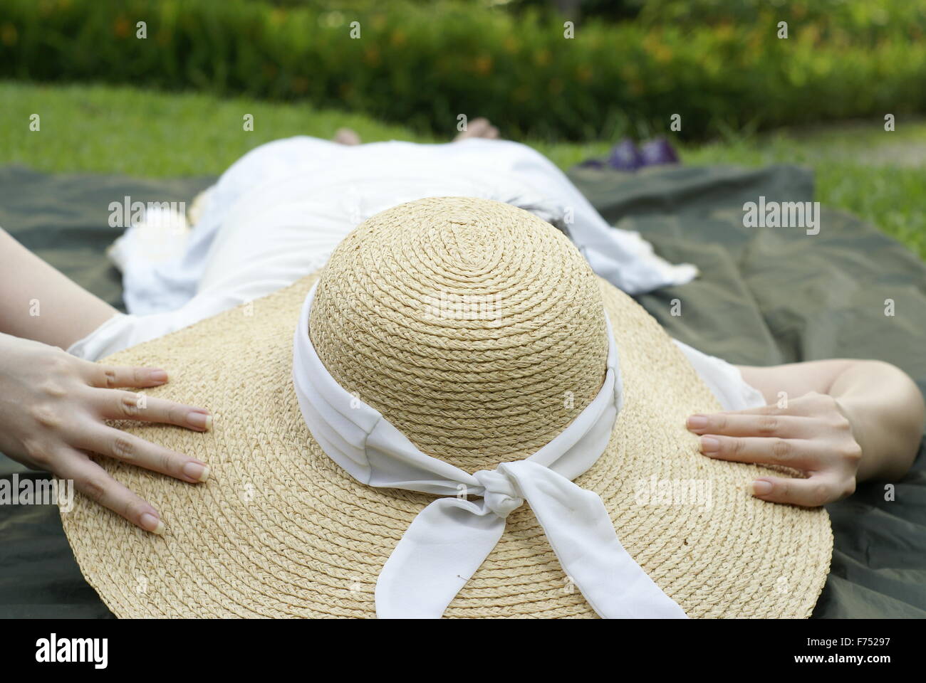 Lady sleeping outdoor on grass Stock Photo - Alamy