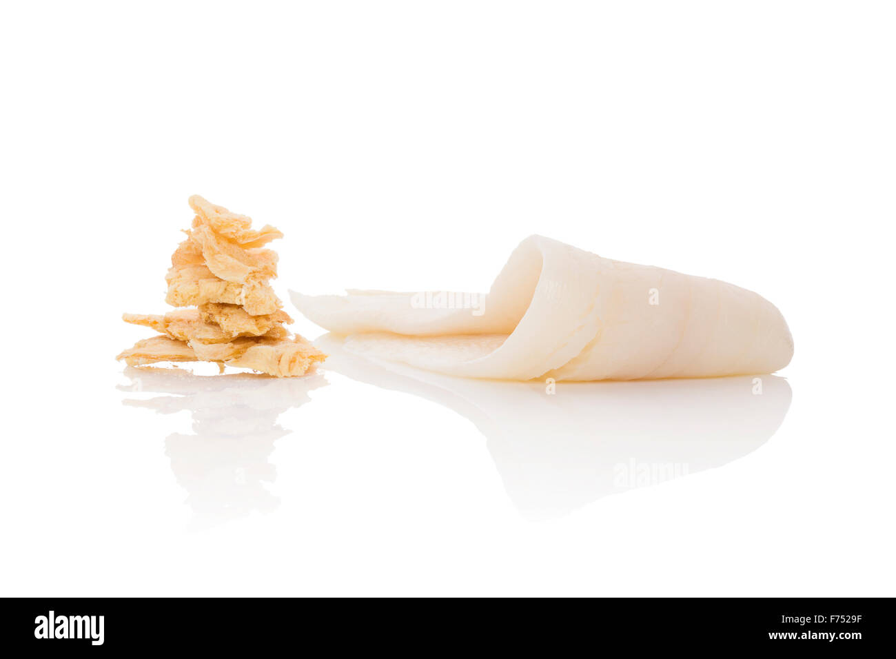 Fresh halibut fillet and dry fish snack isolated on white background ...