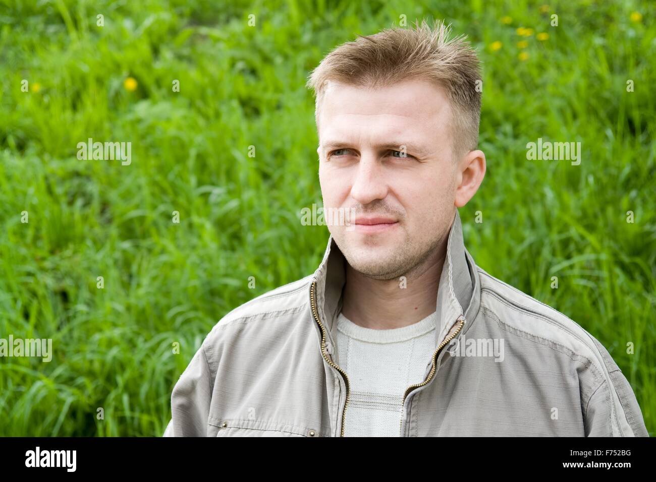 man against grass Stock Photo - Alamy