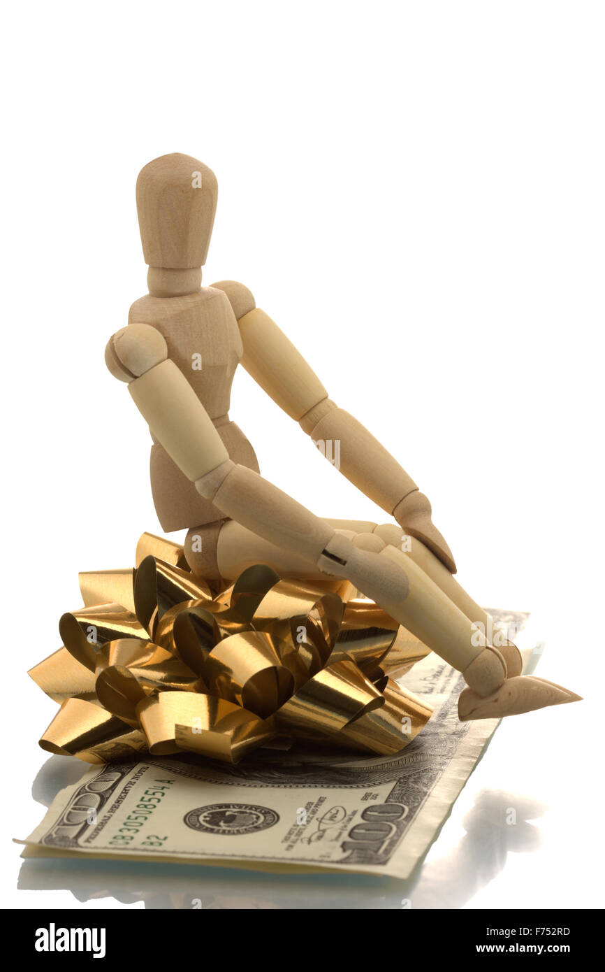 Manikin sitting on a gift wrap Stock Photo - Alamy