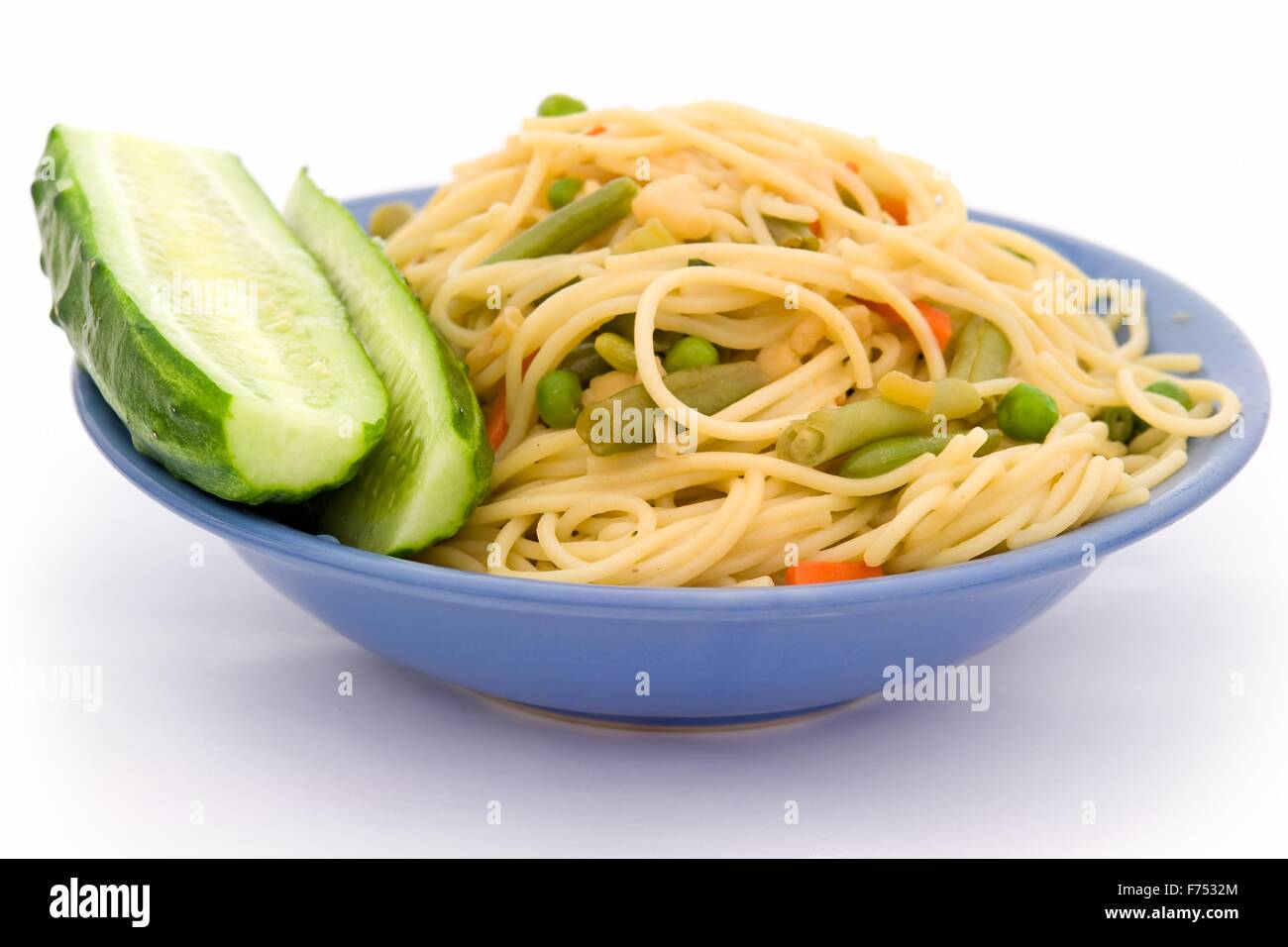 Spaghetti and green cucumber Stock Photo - Alamy