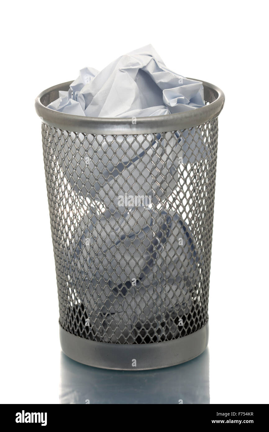 Mesh trash bin full of paper Stock Photo - Alamy