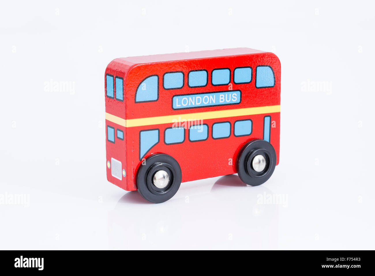 Red London bus wooden toy on white background - for London Transport ...