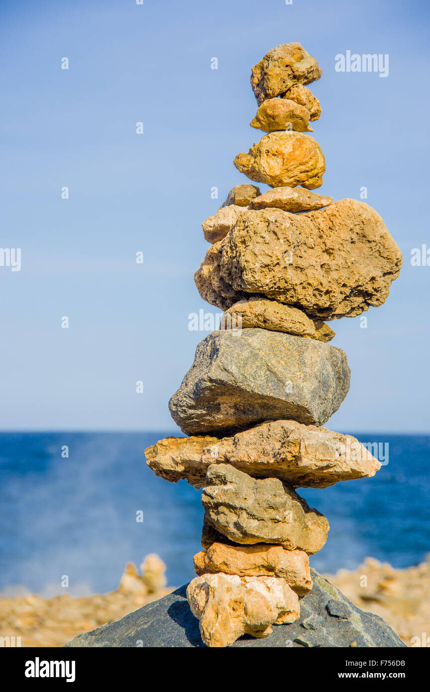 Stack of stones on sea shore, Aruba Stock Photo - Alamy