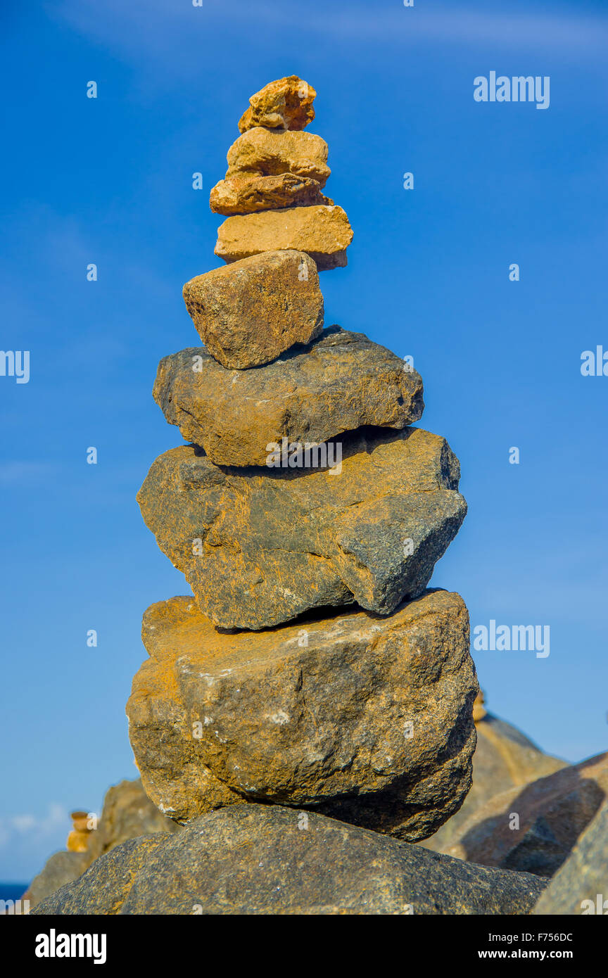 Stack of stones on sea shore, Aruba Stock Photo - Alamy