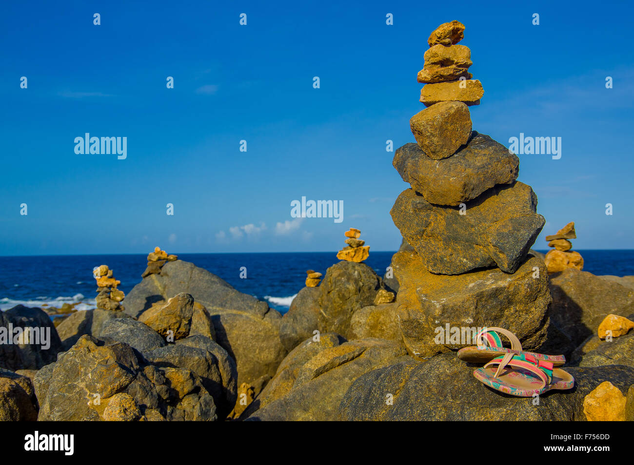 Stack of stones on sea shore, Aruba Stock Photo - Alamy